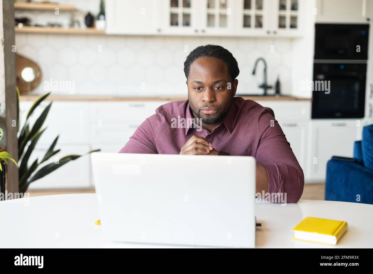 Serious guy staring computer monitor hi-res stock photography and ...