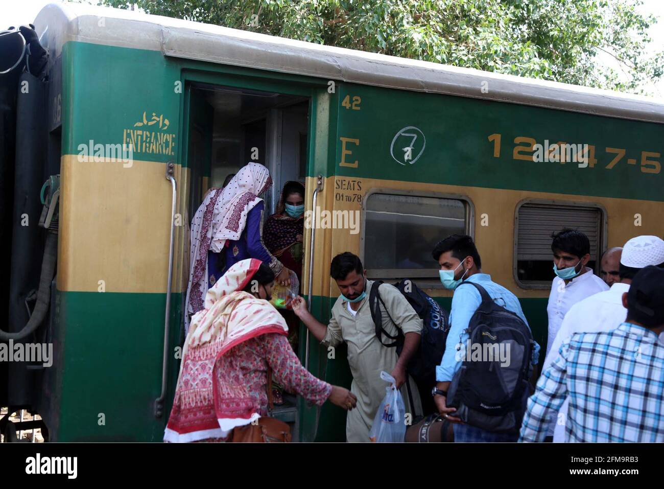 KARACHI, PAKISTAN, MAY 07: People to board on special Eid train as they ...