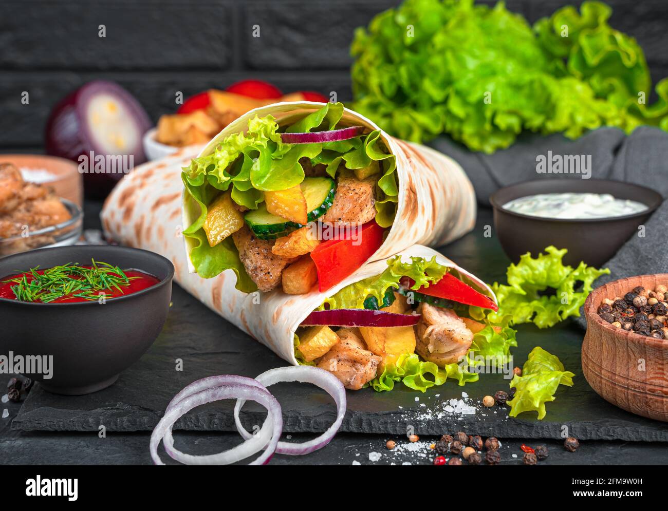 Traditional oriental shawarma close-up on a black background. Meat ...