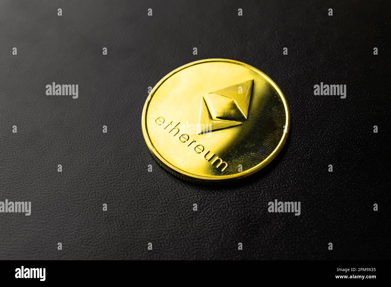 Ethereum cryptocurrency close-up view on black background, business and ...