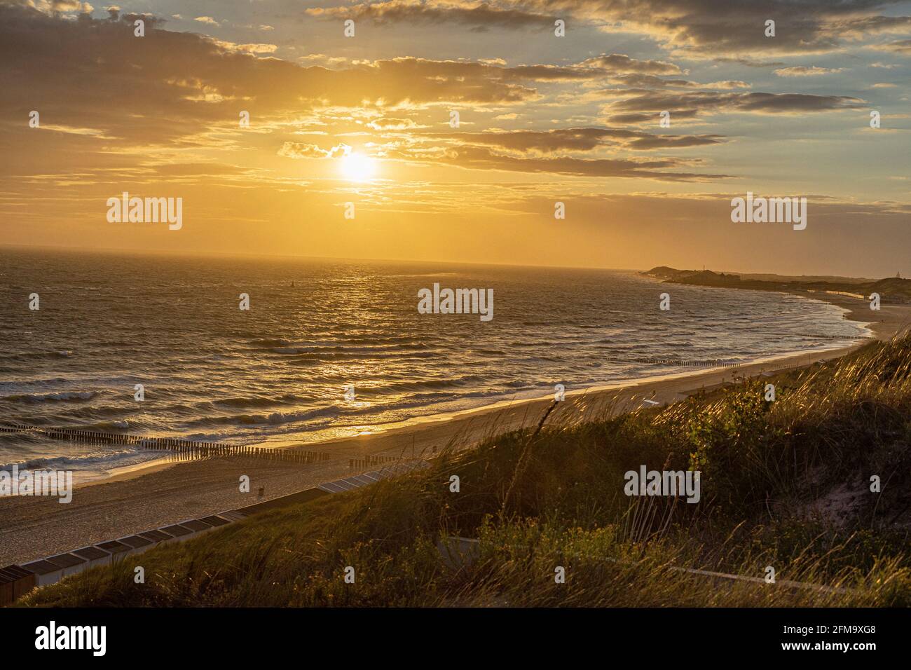 Sunset over the dunes of Holland Stock Photo - Alamy