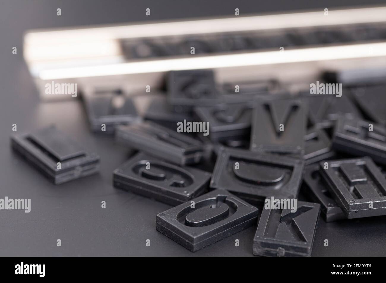 letterpress alphabet and numbers on black background Stock Photo - Alamy