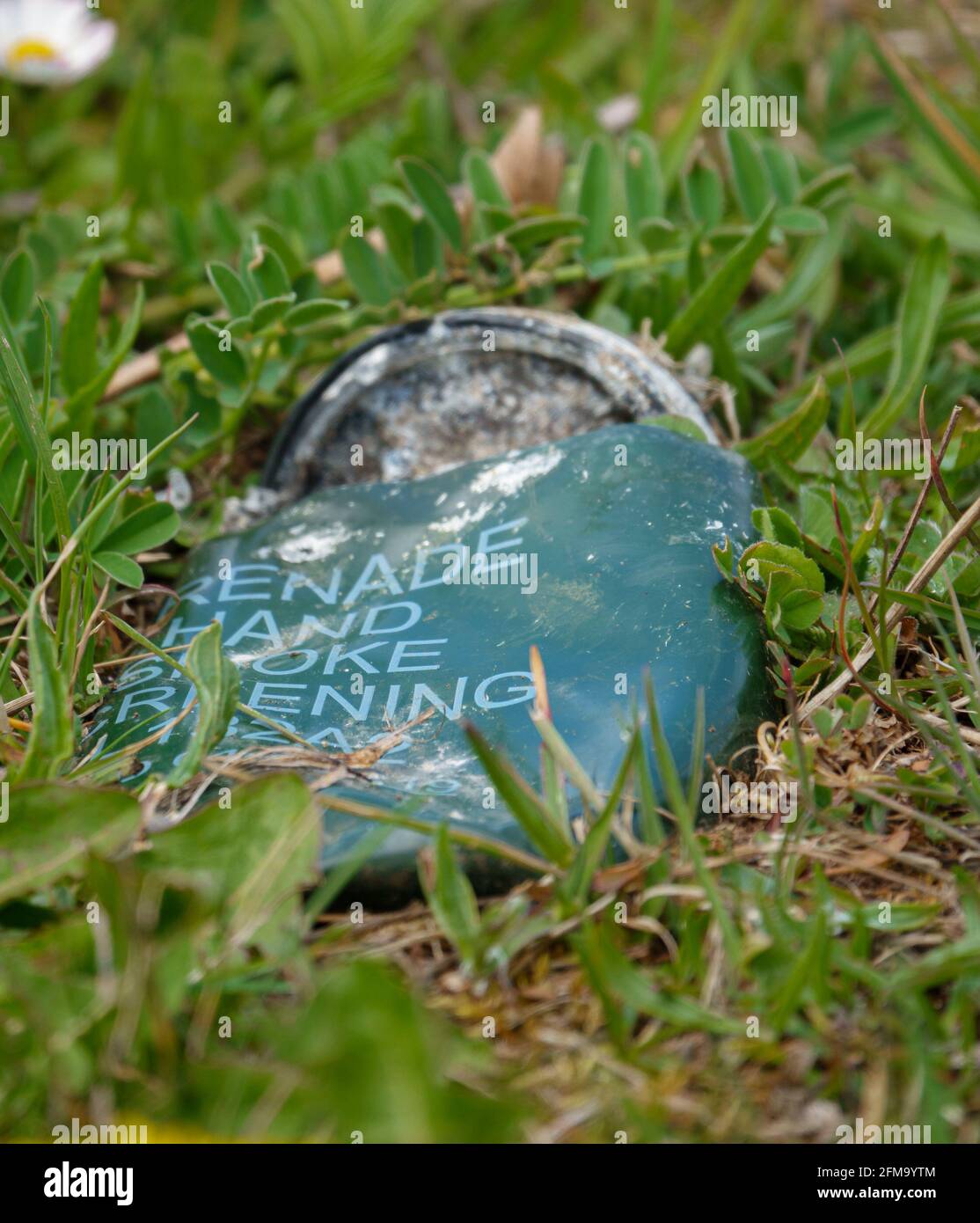 crushed british army green smoke hand grenade Stock Photo - Alamy