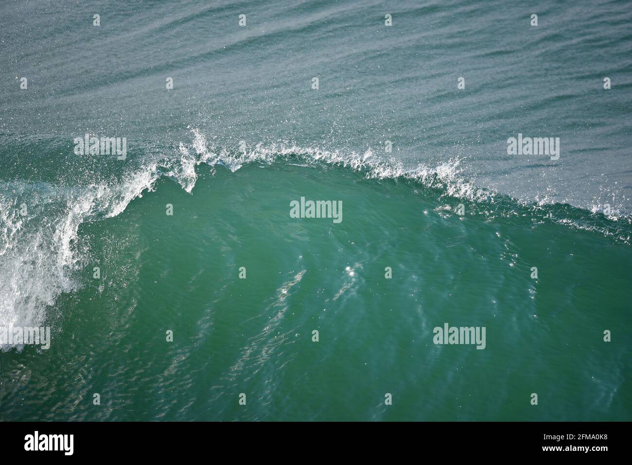 Surfing wave on the shoreline of Huntington Beach in Orange County ...