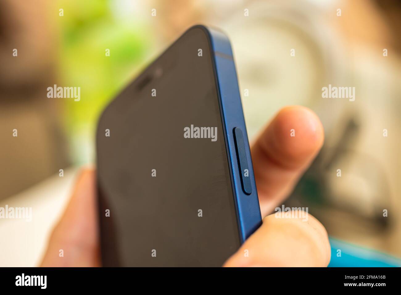 Kharkov, Ukraine - April 27, 2021: Apple iPhone 12 power up button ...