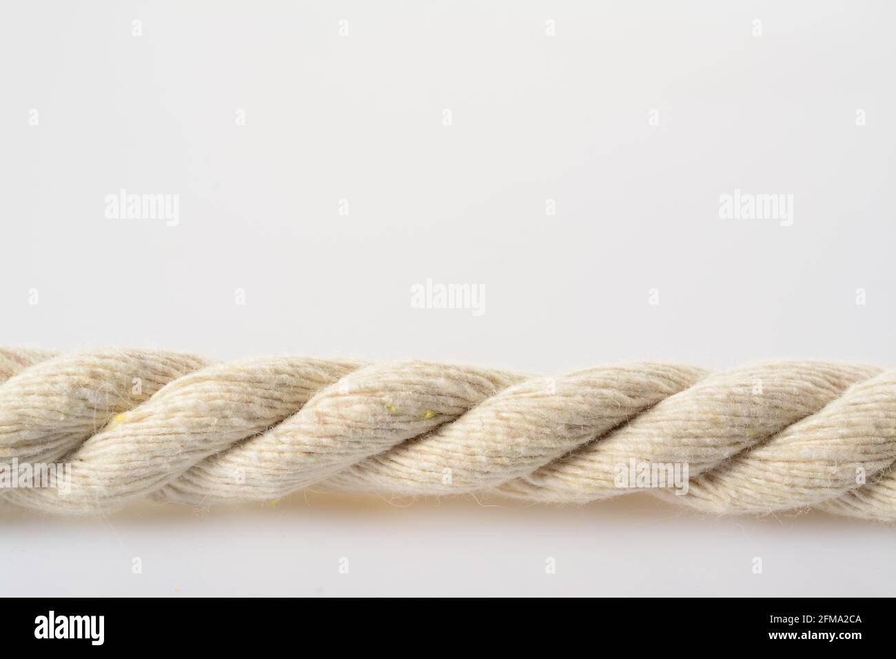 White jute rope horizontal view. Piece of ship rope, close up on white ...