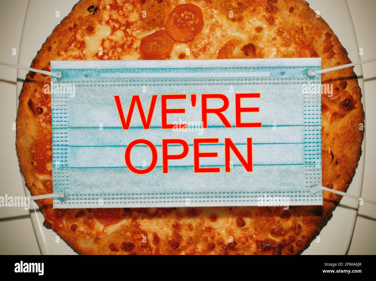Surgical mask with a pizza Stock Photo - Alamy