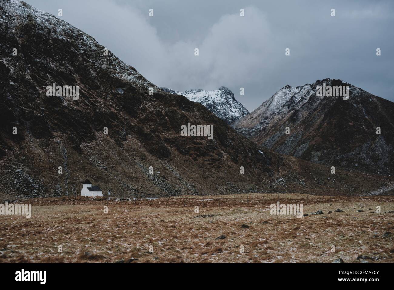 Landscape of the Lofoten near Unstad with a small white wooden chapel ...