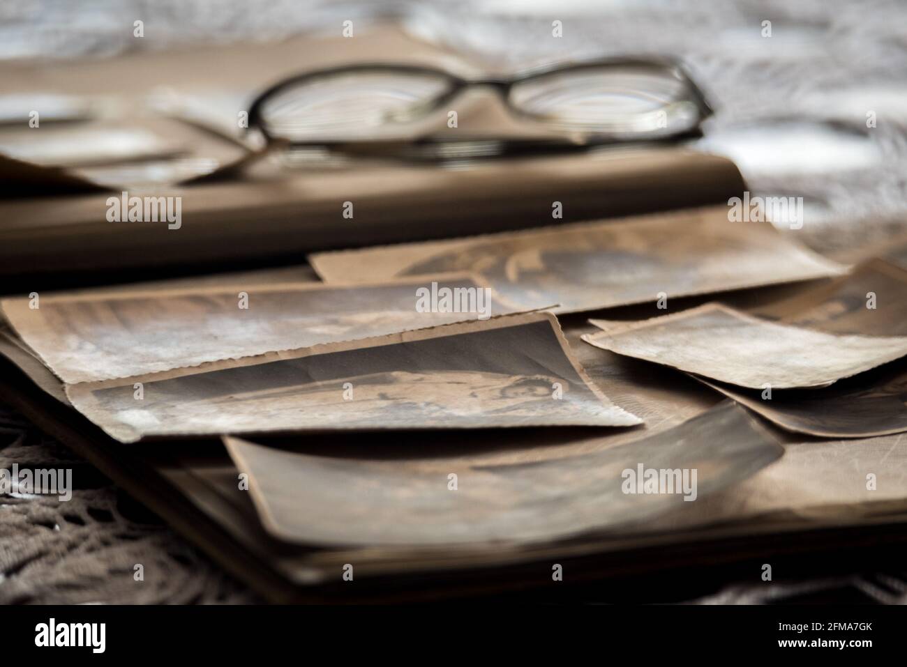 Viewing old photos in an album. Black and white pictures on the old ...