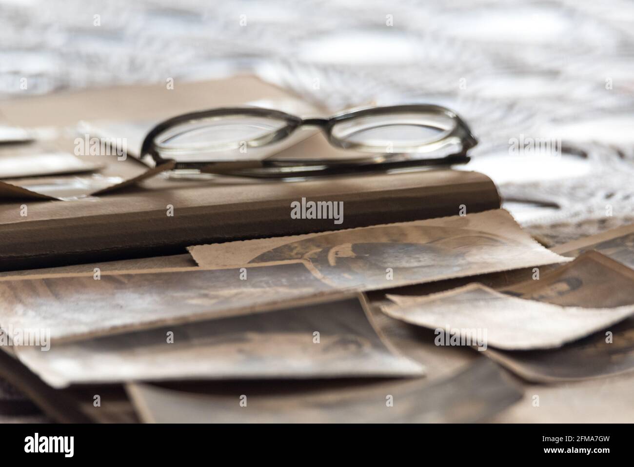 Viewing old photos in an album. Black and white pictures on the old ...