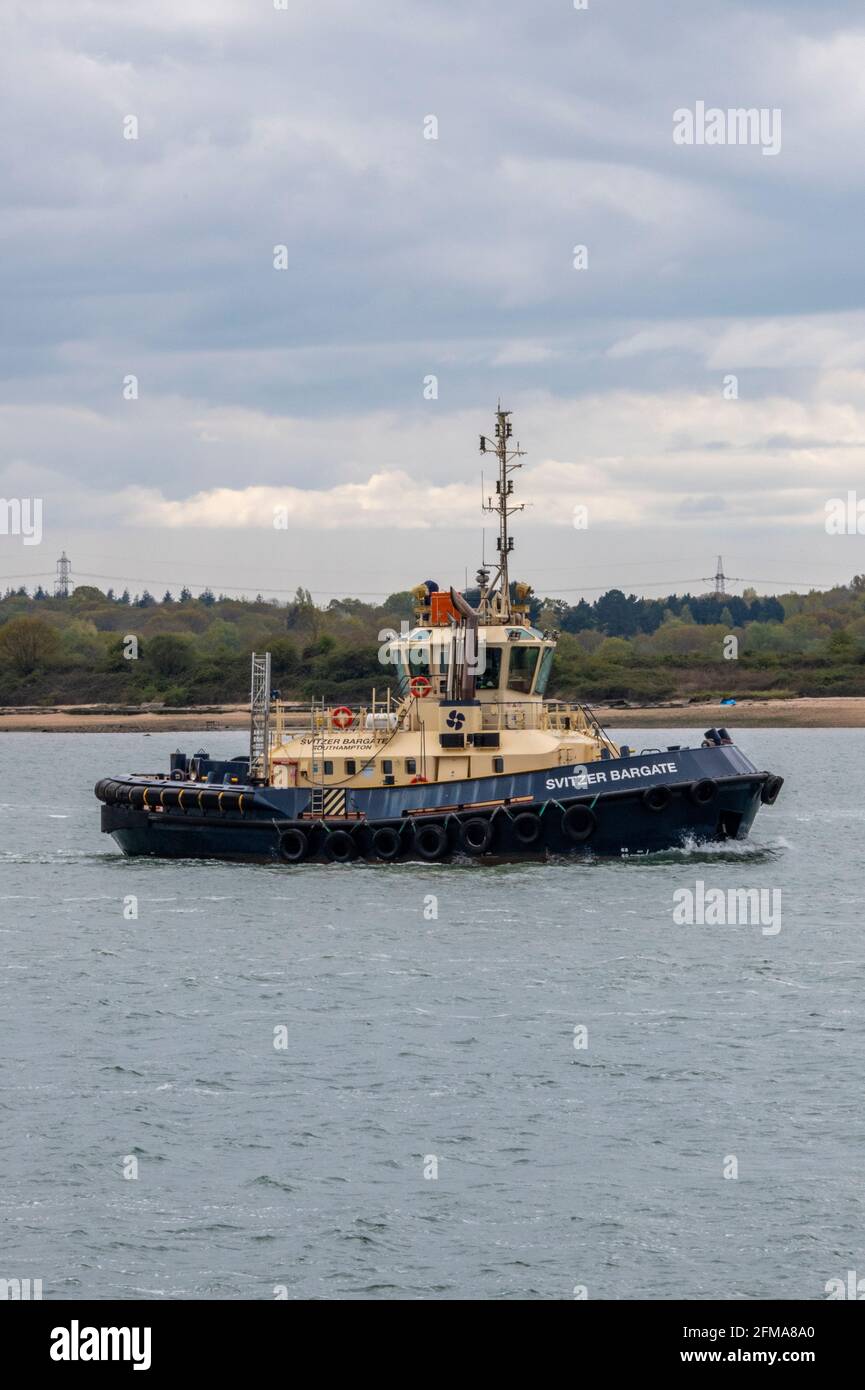 the tugboat svitzer bargate in southampton docks waiting for a ship to ...