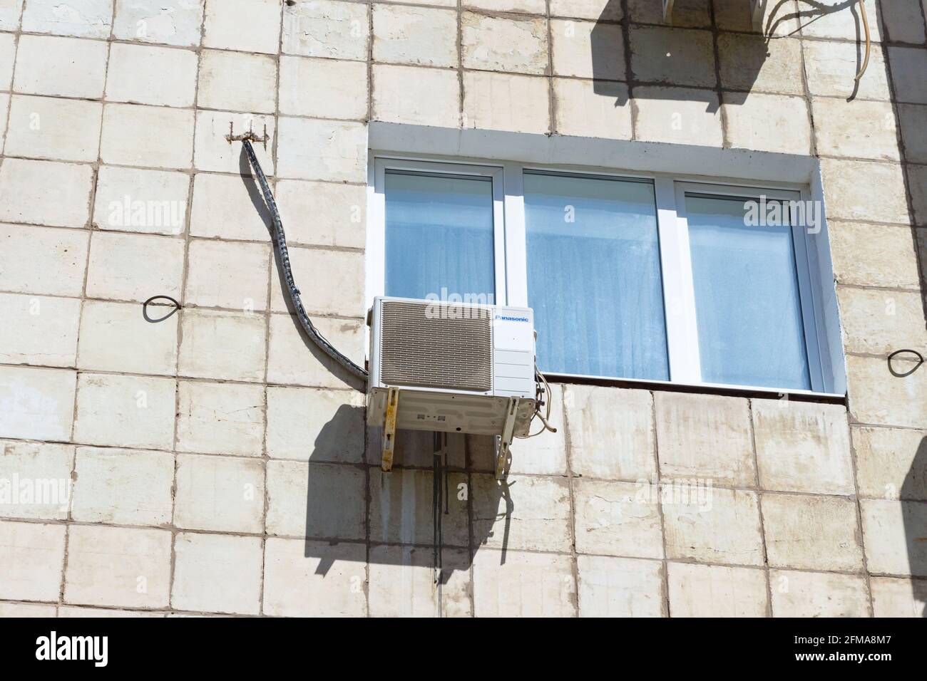 Outdoor units of split air conditioning systems are installed on a ...