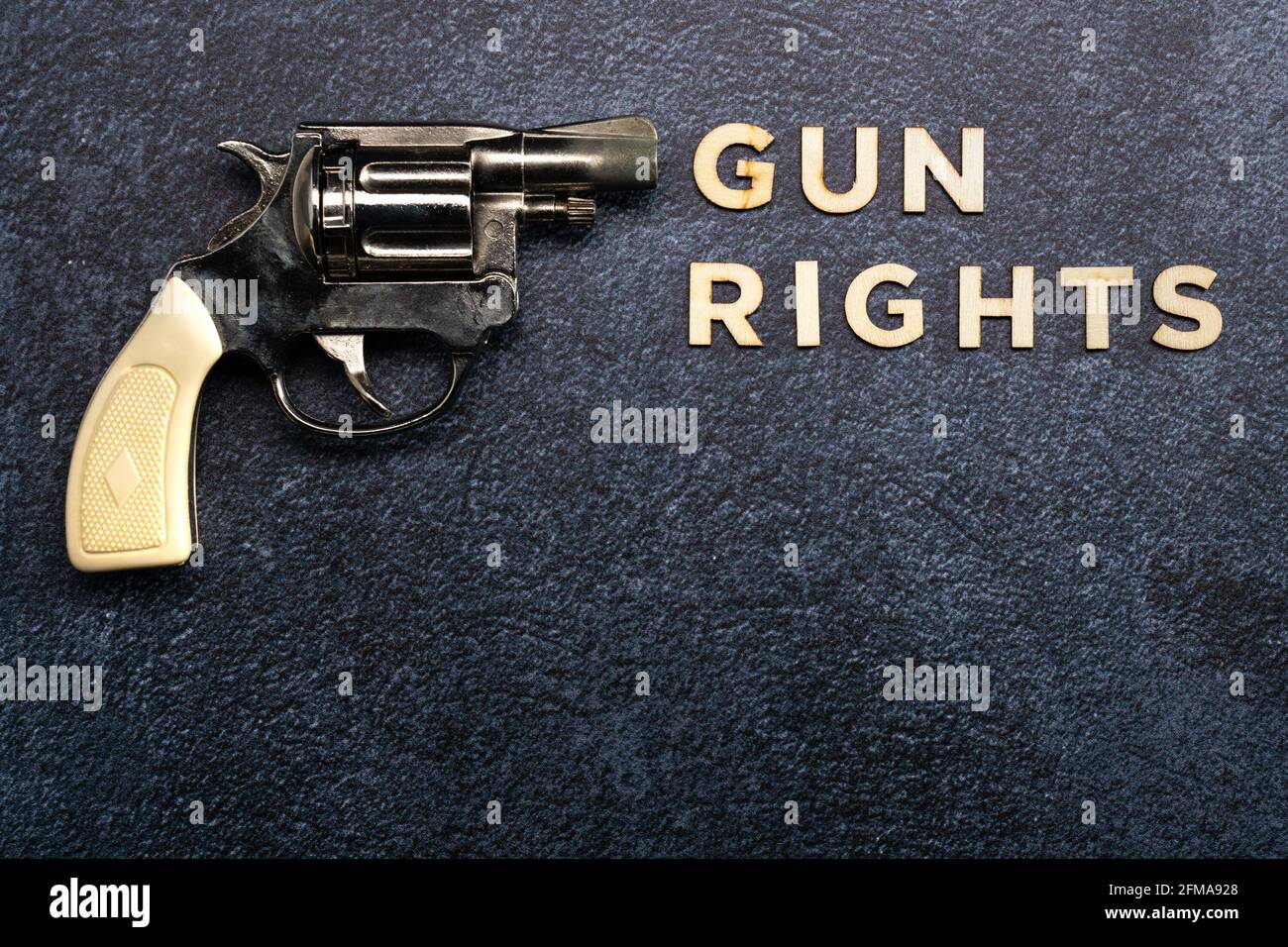 gun rights concept on a blue background with text and a pistol Stock ...