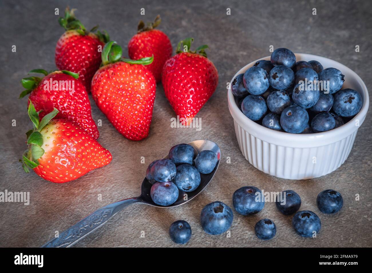 strawberries and blueberries, small colored fruits Stock Photo - Alamy