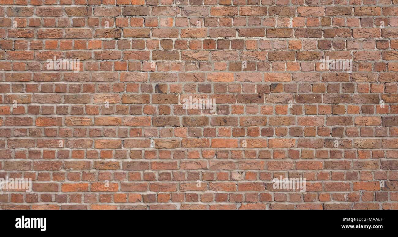 wide 4K red brick wall useful as a background Stock Photo - Alamy