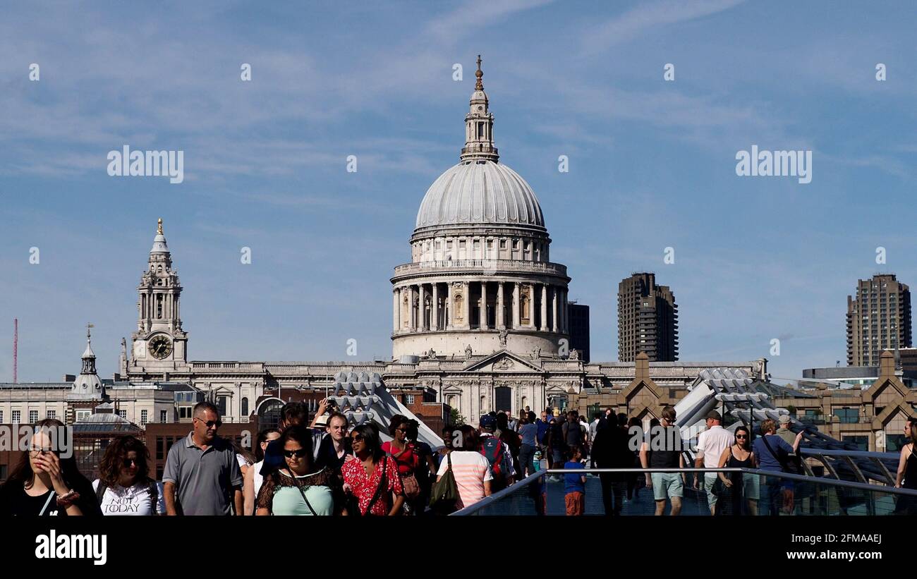 LONDON, UK - CIRCA SEPTEMBER 2019: Crowd of people crossing Millennium ...