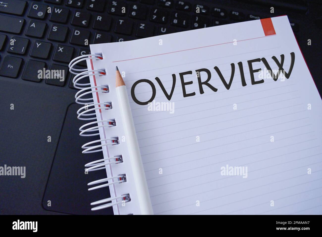 Overview word written in Notebook on the keyboard.Conclusion, summary ...