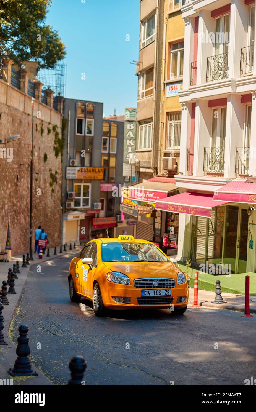 Yellow taxi car on a city street in Istanbul. Istanbul, Turkey - 28.07. ...