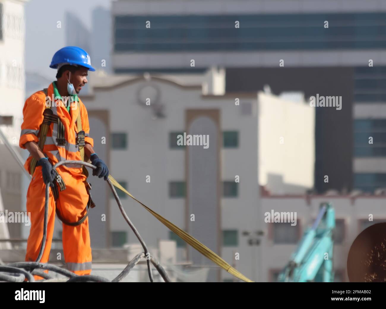 View of Labour working under hot weather conditions in Doha, Qatar ...