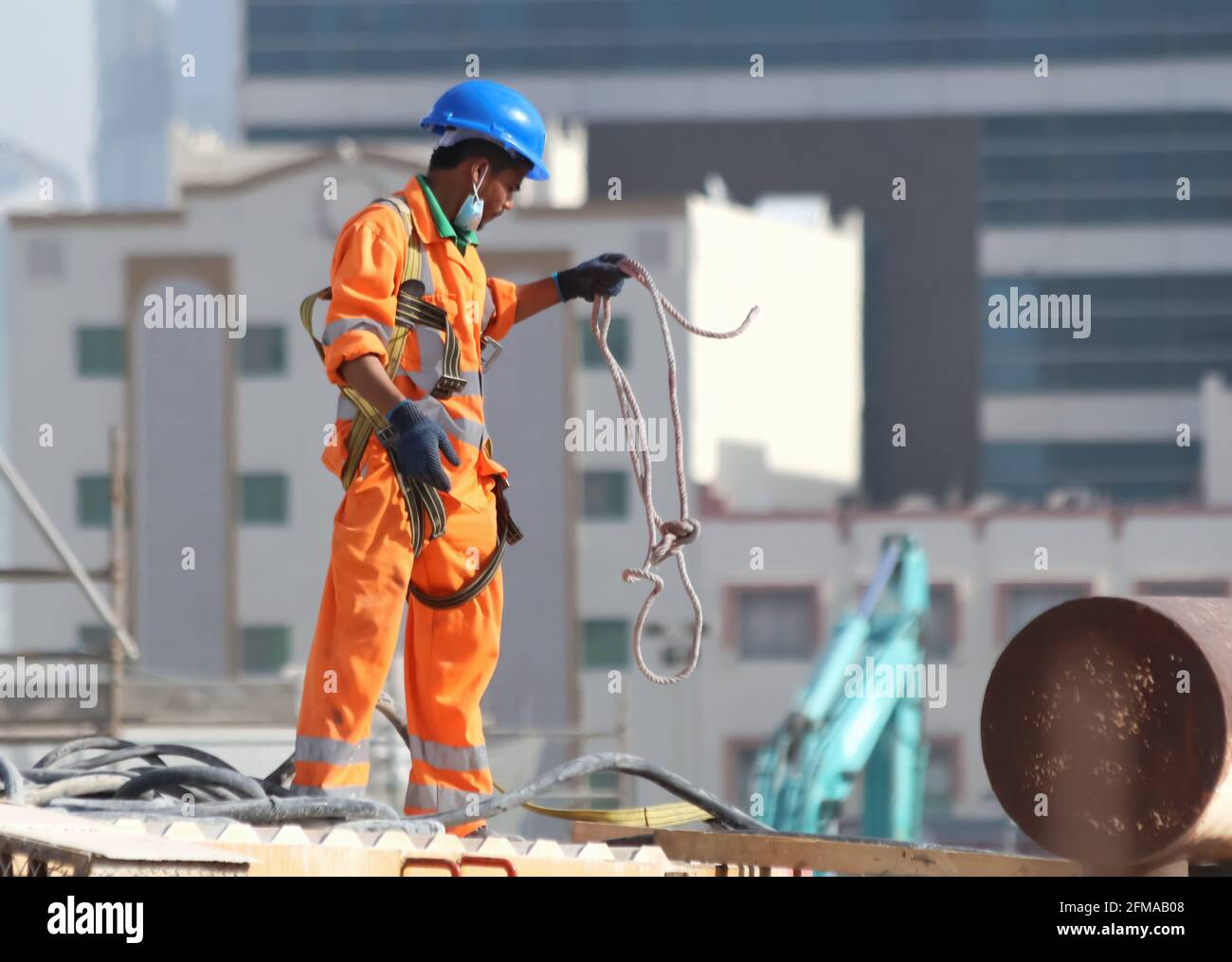 View of Labour working under hot weather conditions in Doha, Qatar ...