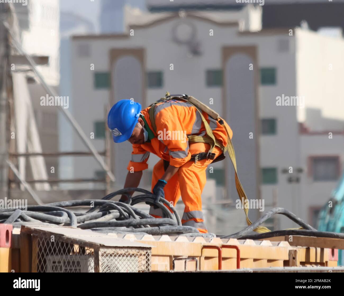 View of Labour working under hot weather conditions in Doha, Qatar ...