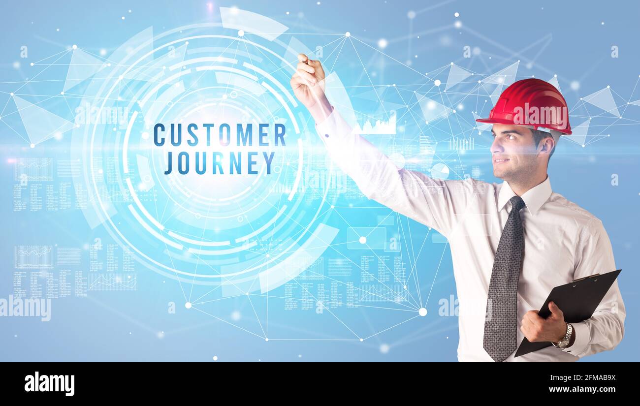 Handsome businessman with helmet drawing Stock Photo - Alamy