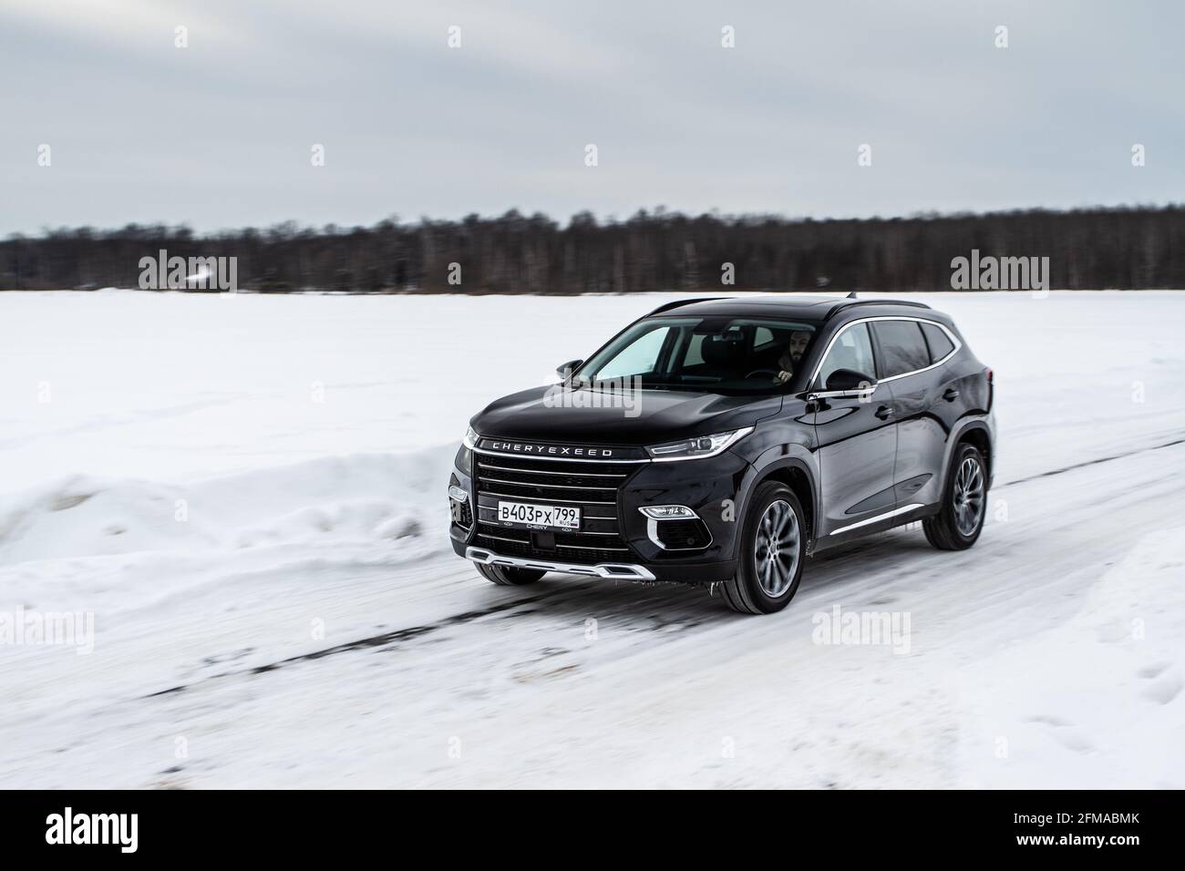 MOSCOW, RUSSIA - FEBRUARY 23, 2021 CHERYEXEED TXL SUV car in motion ...