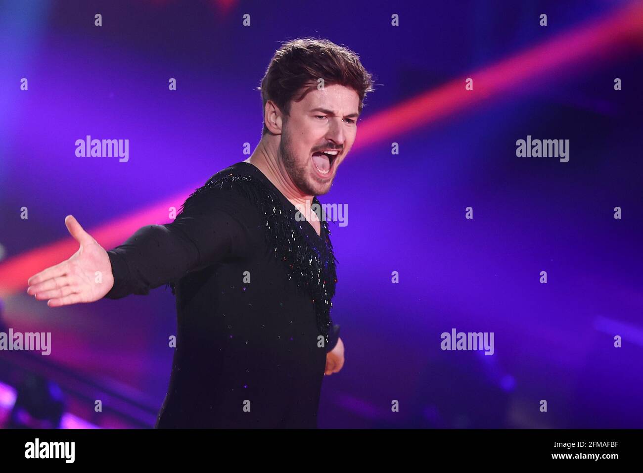 Cologne, Germany. 07th May, 2021. Nicolas Puschmann, actor, dances to ...