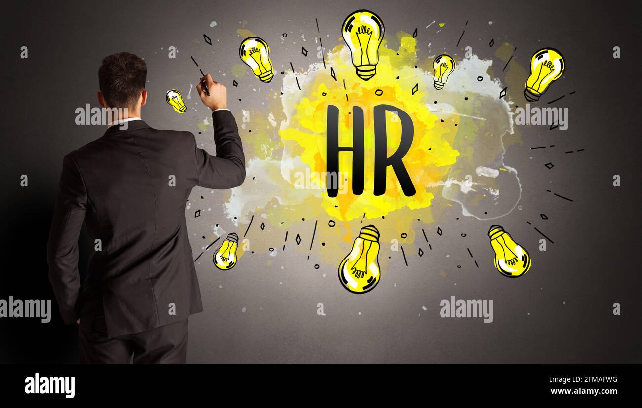 man drawing colorful light bulb Stock Photo - Alamy