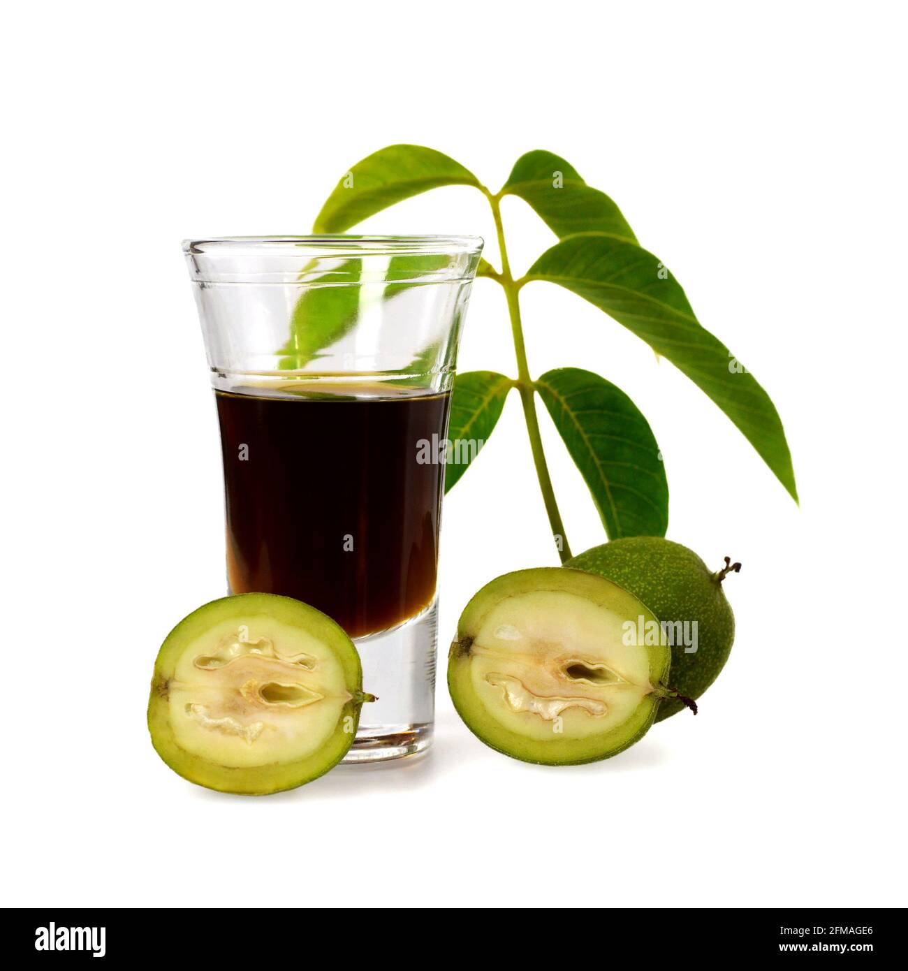 Glass of walnut liqueur isolated on white background Stock Photo - Alamy