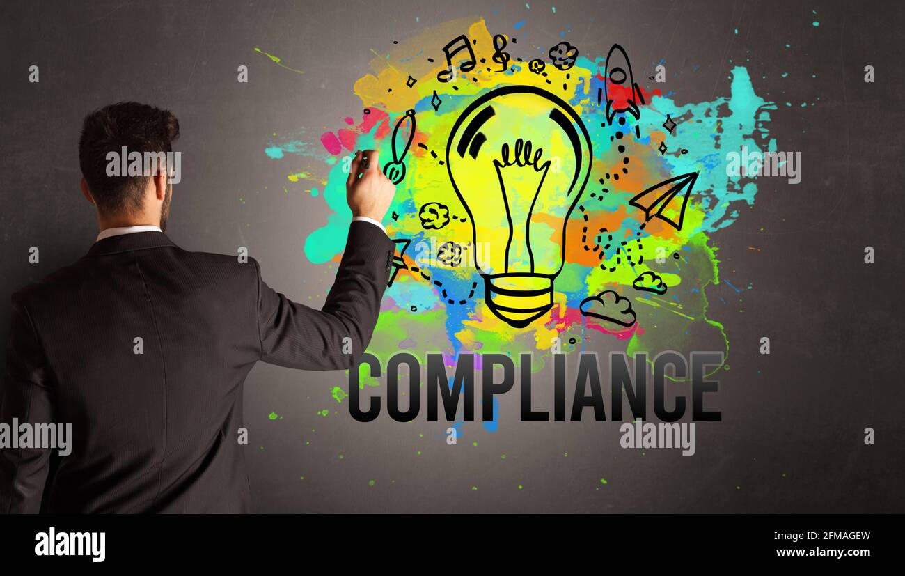 businessman drawing colorful light bulb Stock Photo - Alamy