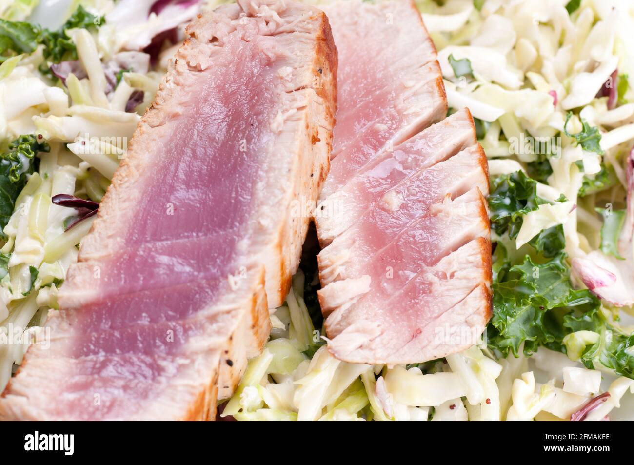 rare cooked tuna with salad Stock Photo - Alamy