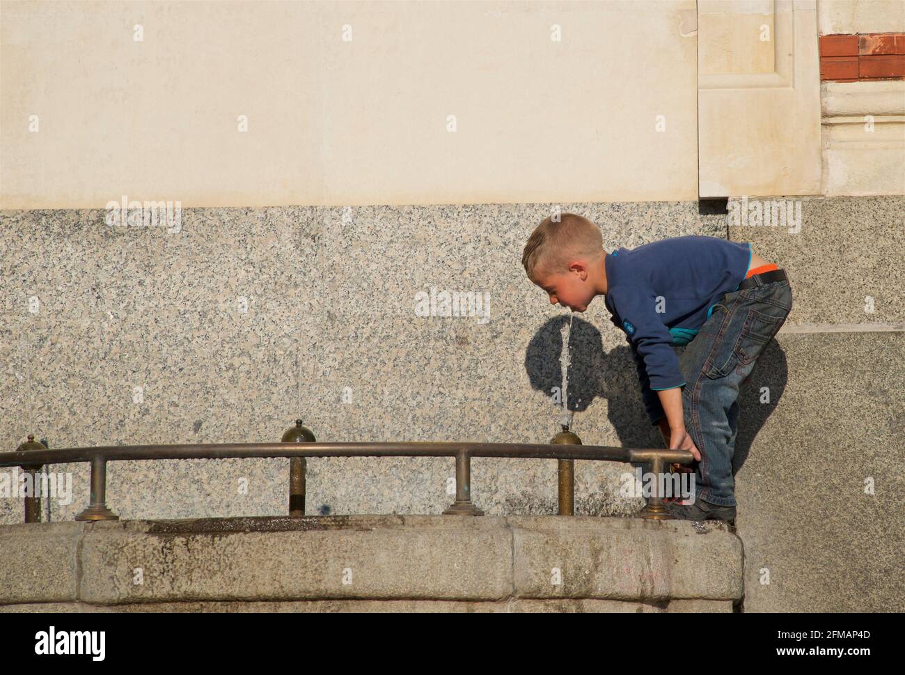 Bulgarian boy stoops to drink fromm a public drinking fountain, Sofia ...