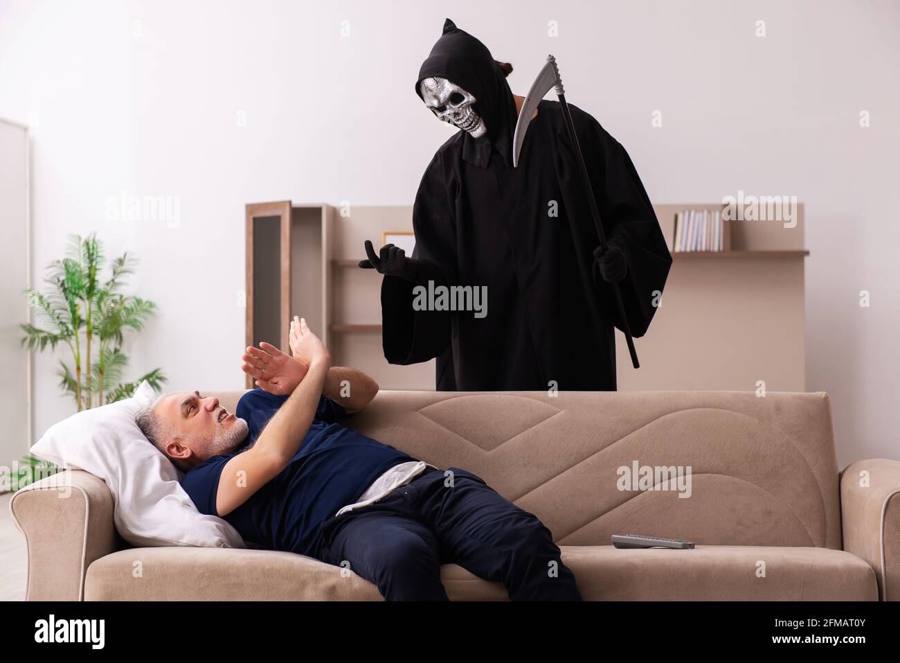Devil coming to old dying man Stock Photo - Alamy