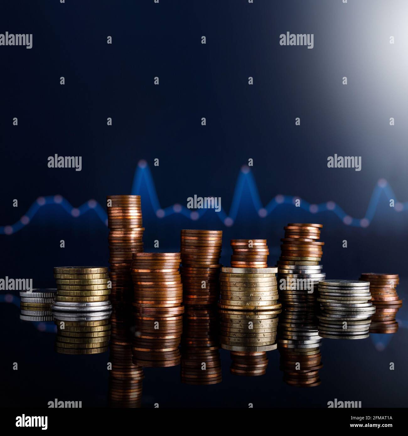 Coins on the background of the chart. Finance concept Stock Photo - Alamy