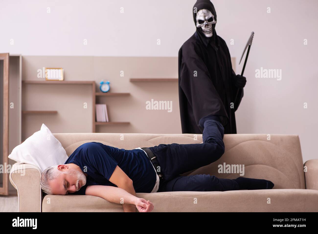 Devil coming to old dying man Stock Photo - Alamy