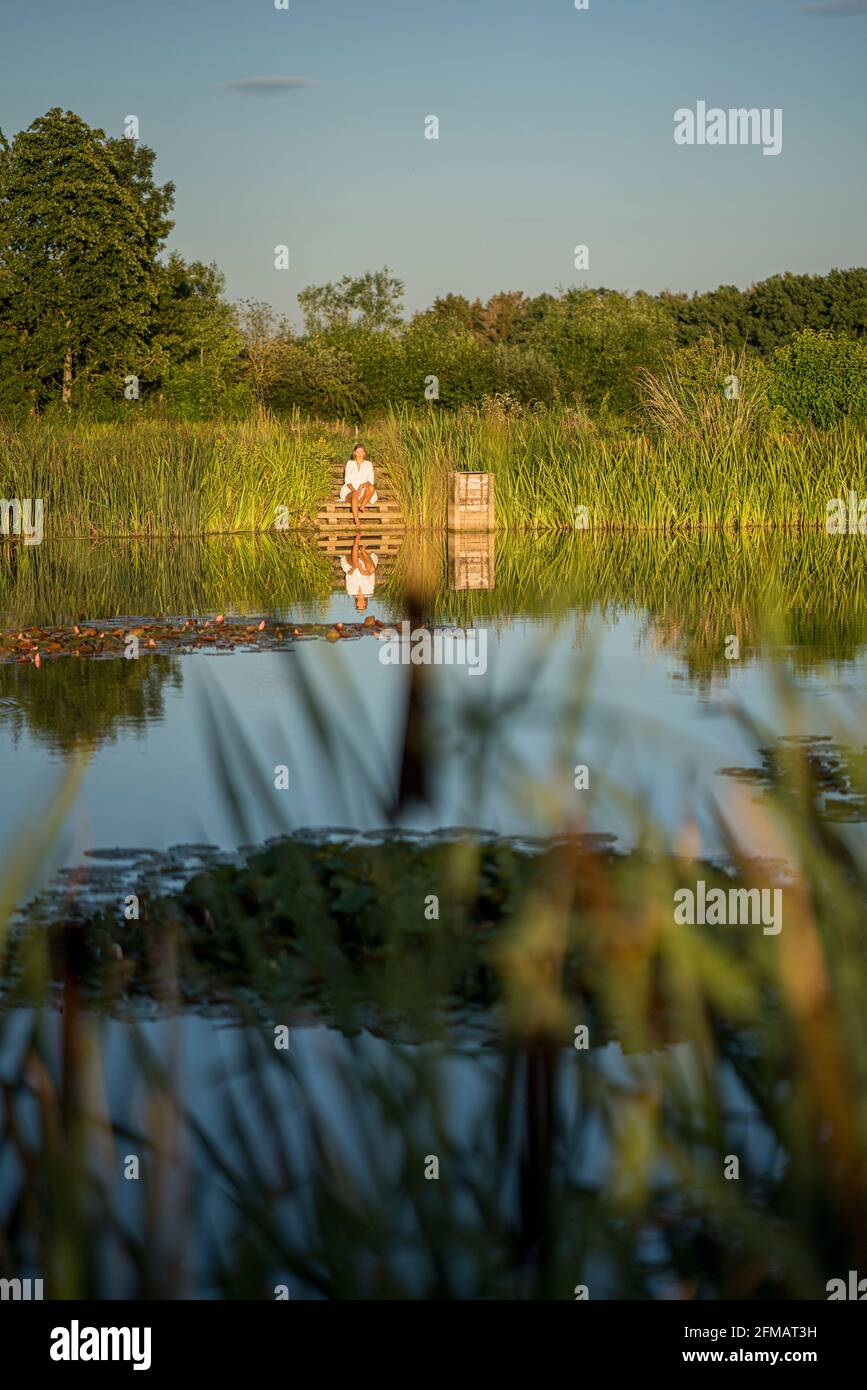 Woman at pond hi-res stock photography and images - Alamy
