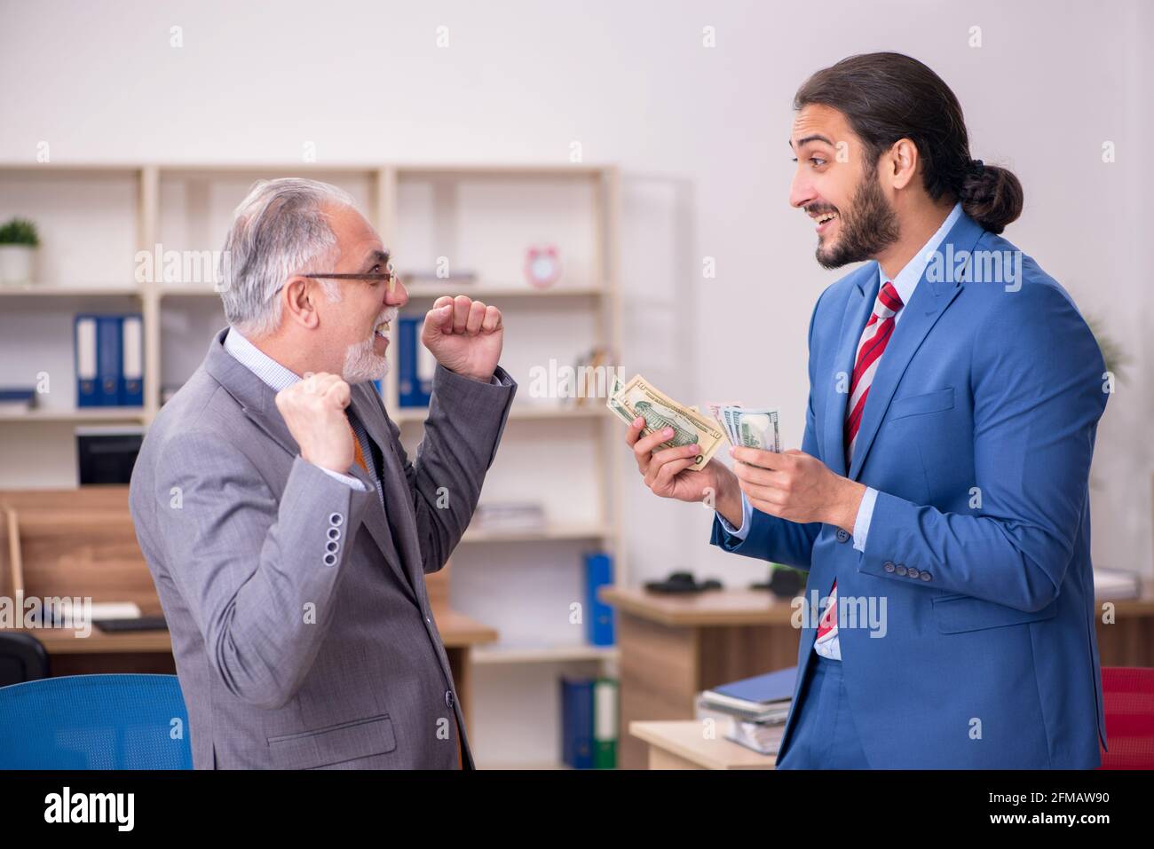 Giving salary to employees hi-res stock photography and images - Alamy