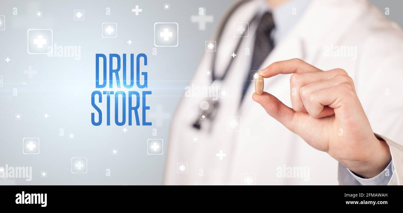 Close-up of a doctor giving a pill Stock Photo - Alamy