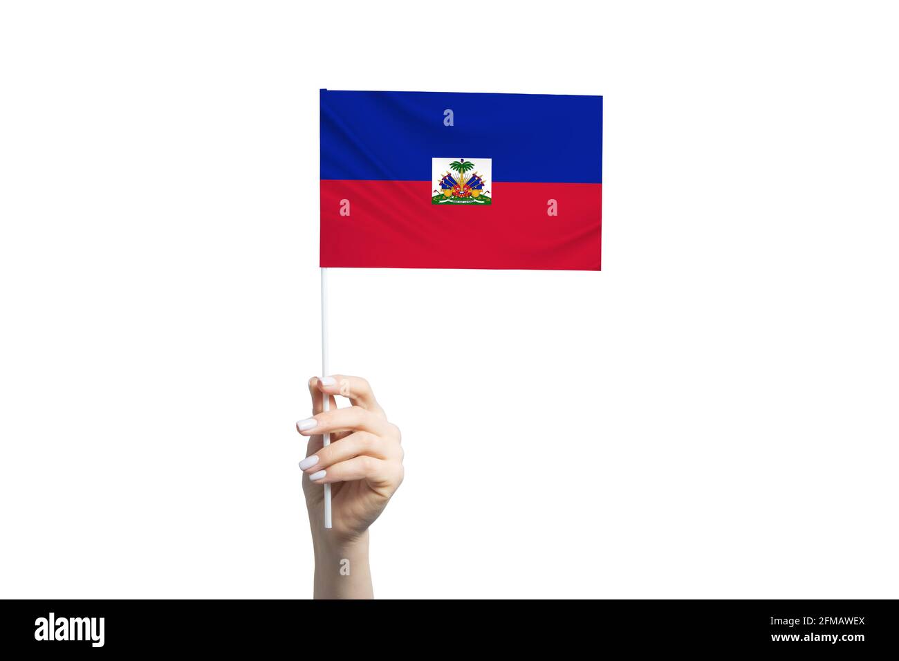 Beautiful female hand holding Haiti flag, isolated on white background ...