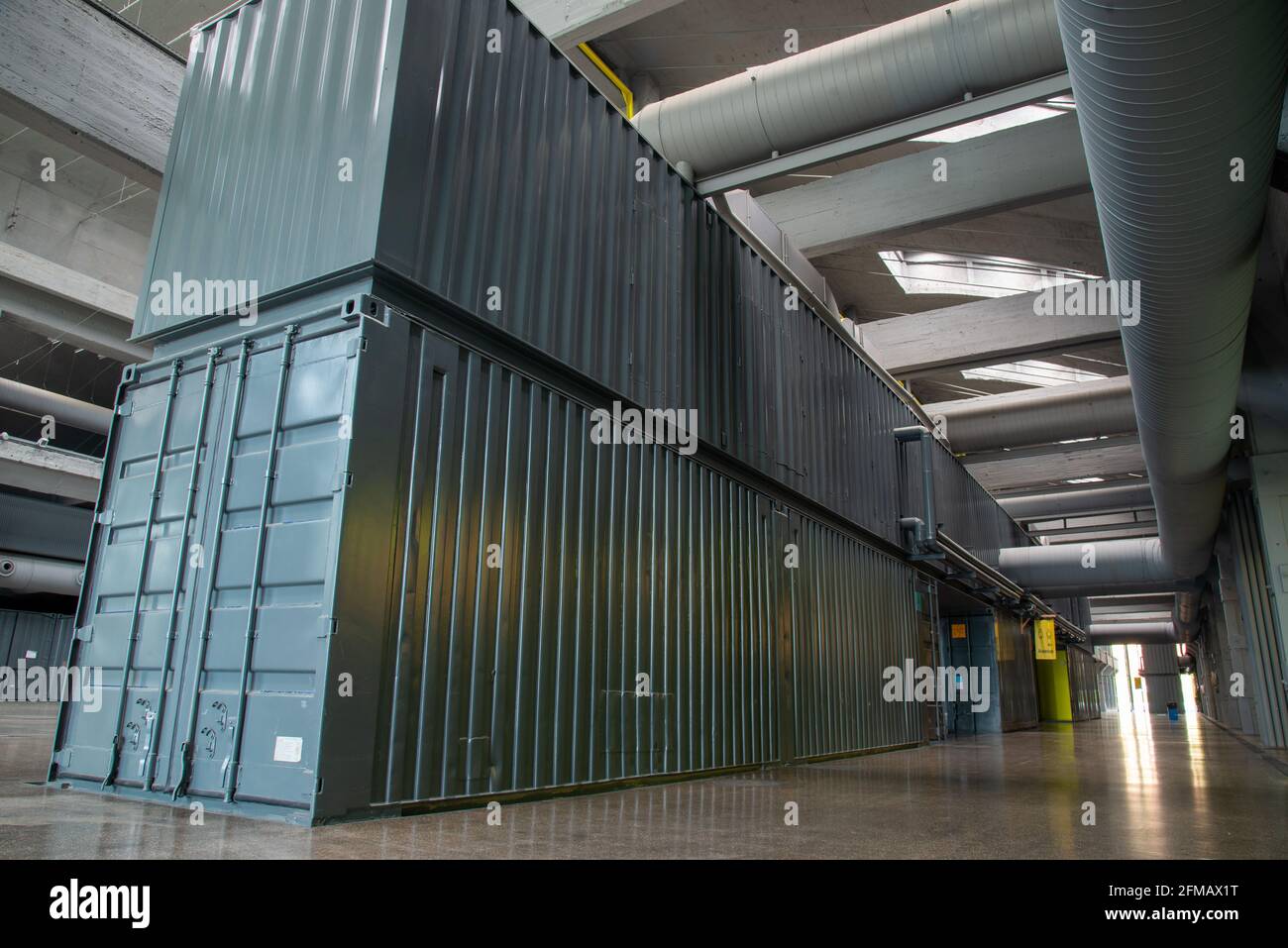 Modernist gray building with tubular shapes and containers Stock Photo ...