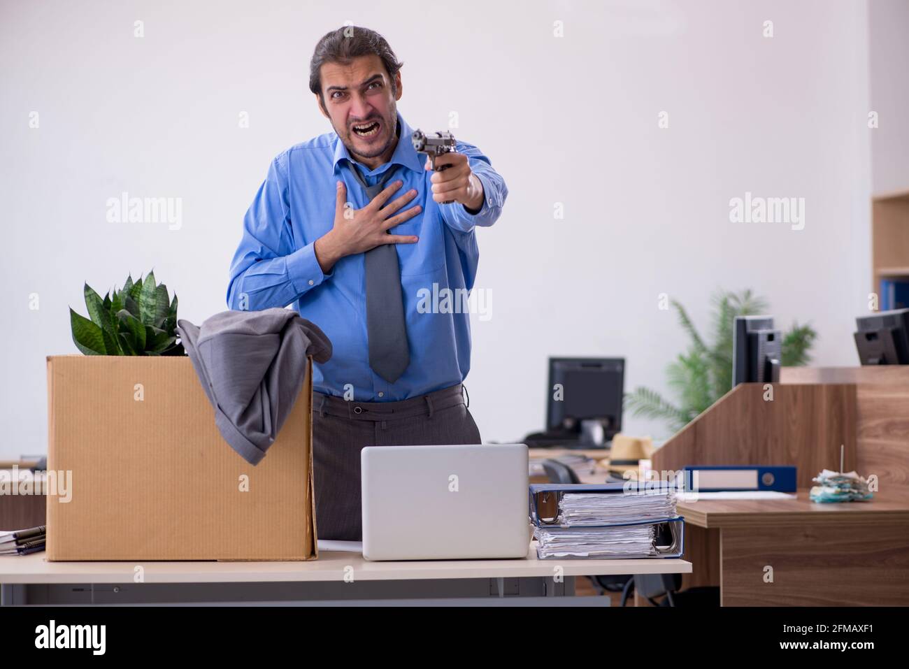 Young employee being fired from his work Stock Photo - Alamy