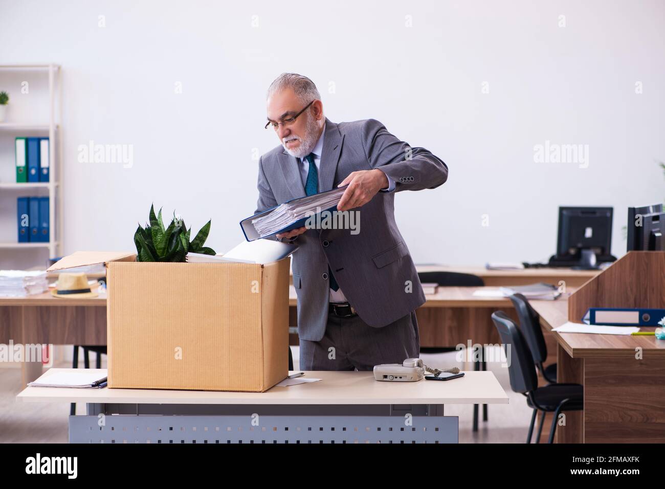 Old employee being fired from his work Stock Photo - Alamy