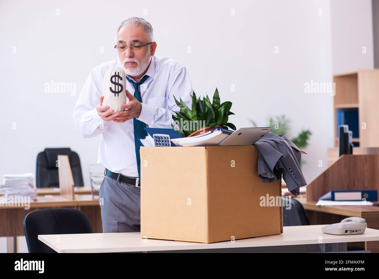 Old employee being fired from his work in retirement concept Stock ...