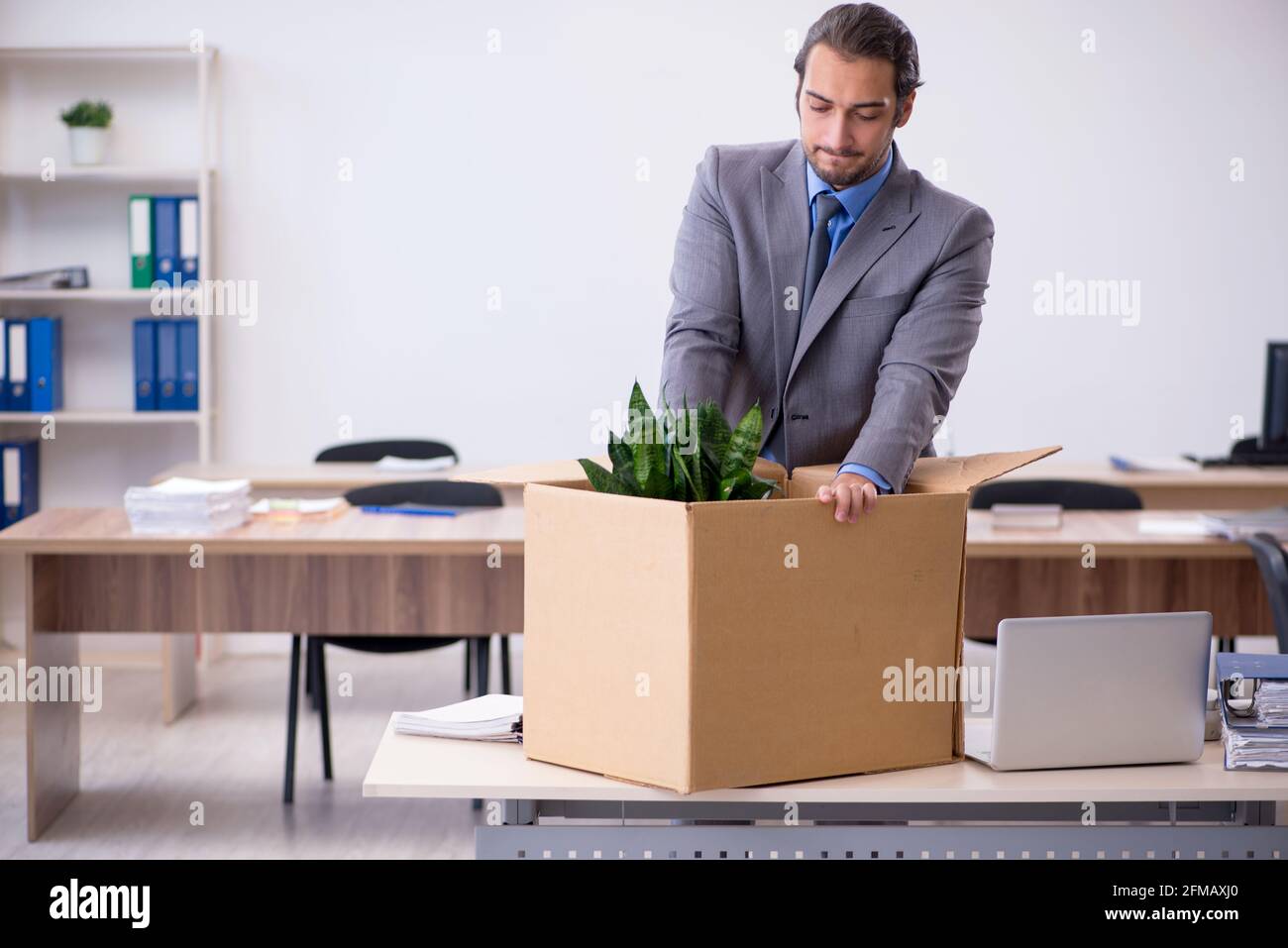 Young employee being fired from his work Stock Photo - Alamy