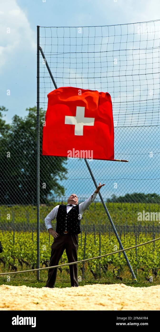 Traditional flag thrower with Swiss flag, Anières, Geneva, Switzerland ...