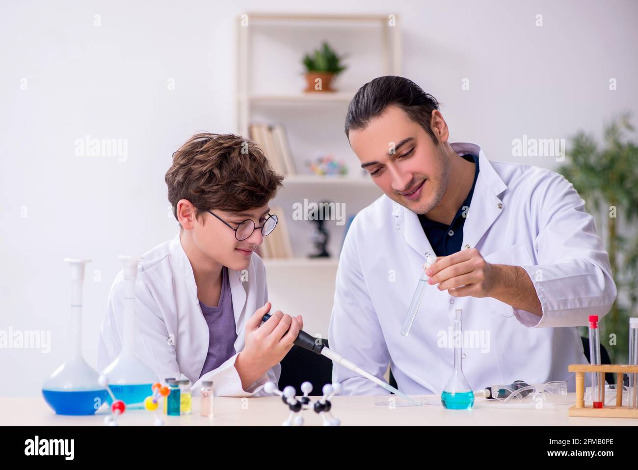 Young father and son chemists in the laboratory Stock Photo - Alamy