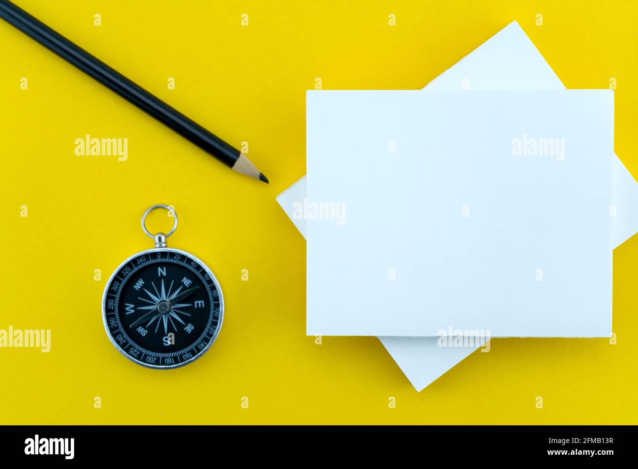 Top view business objects of white paper,pencil,and compass on paper ...