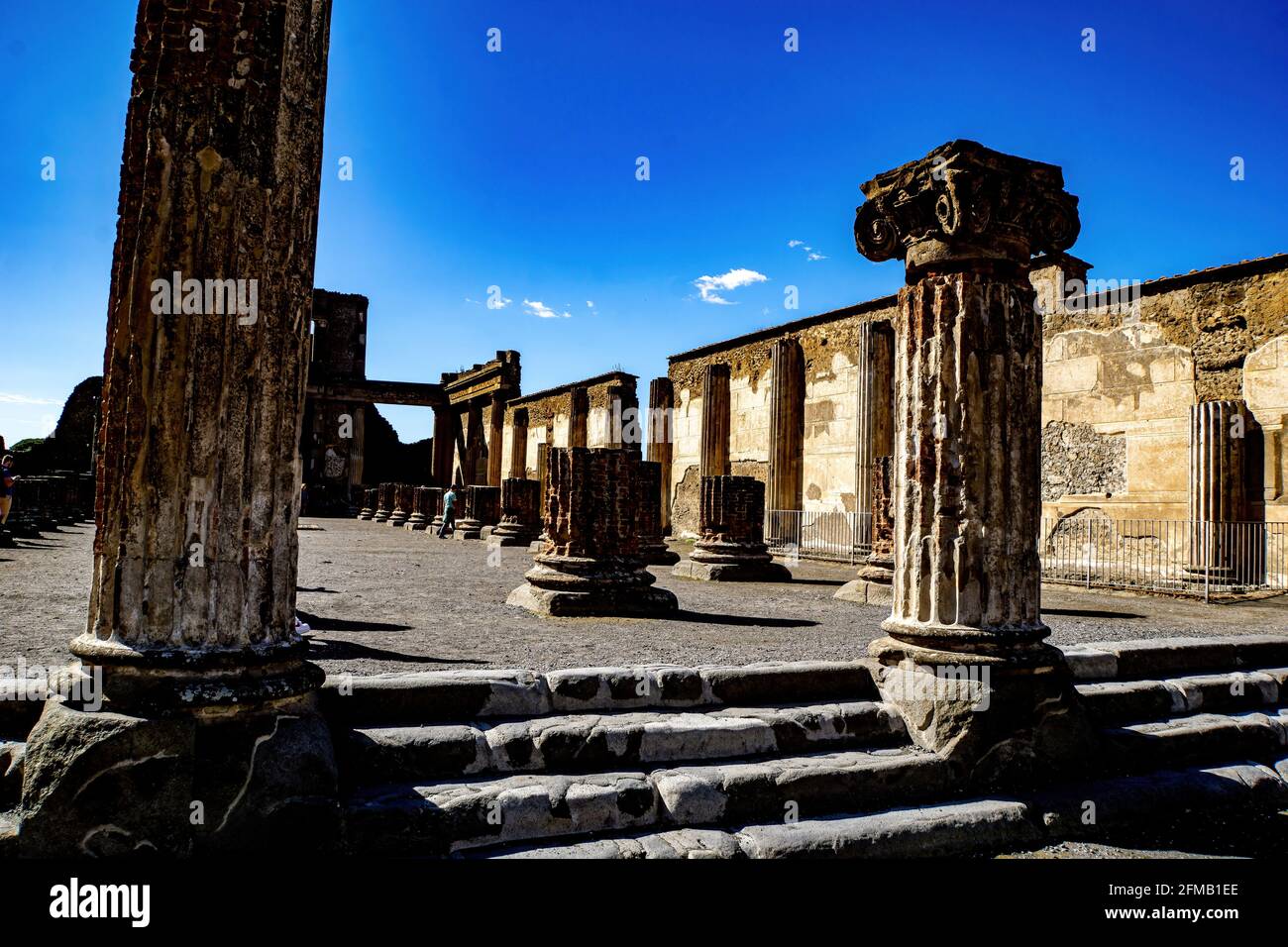 Archaeological site with pillars and ruined buildings - Pompeii, Italy ...