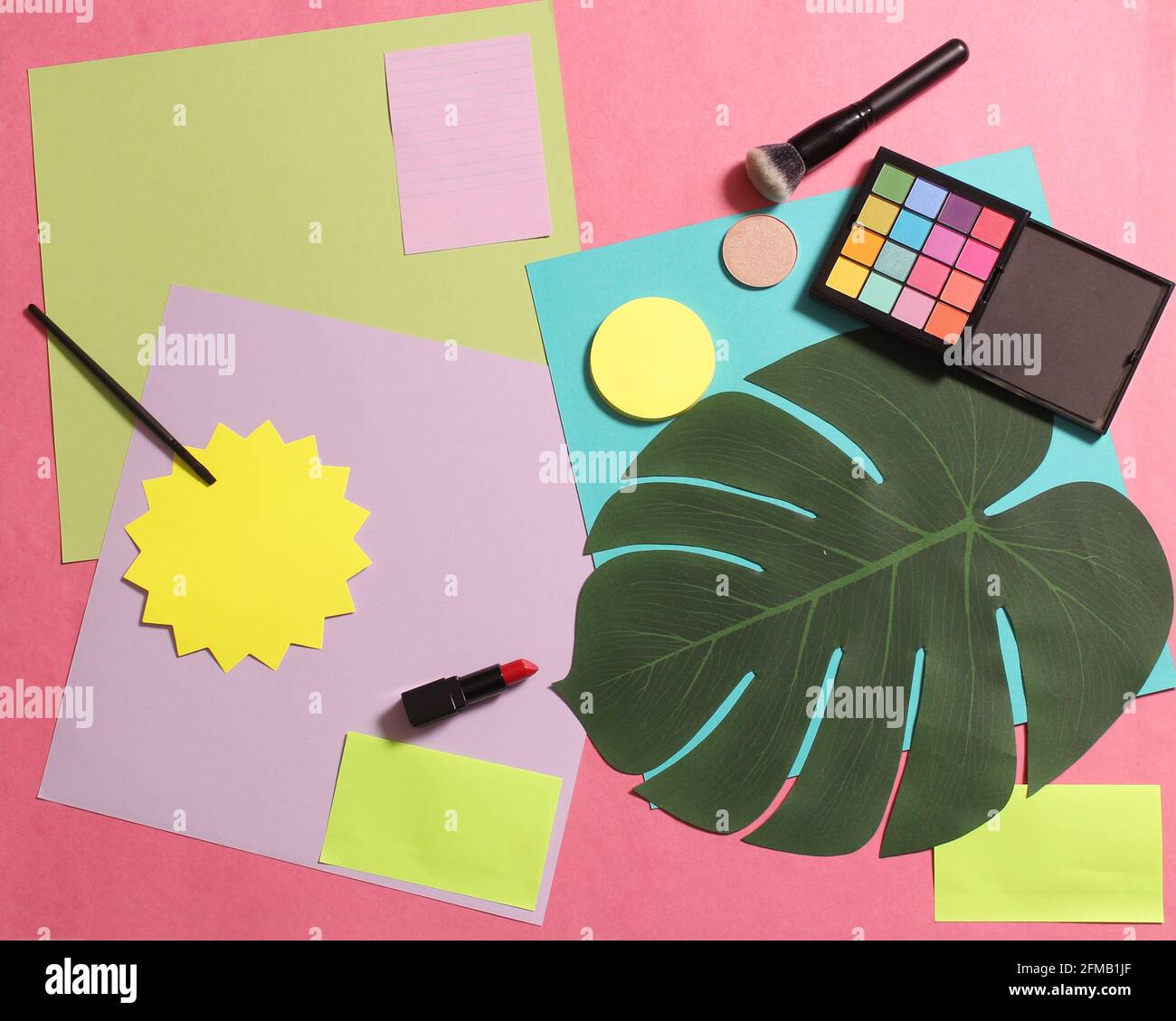 Cosmetics on Paper With Tropical Leaf Stock Photo - Alamy